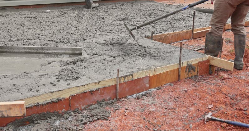 Use of Special Tools by a Construction Worker in Leveling Concrete ...