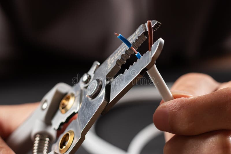 The Use of the Stripper Cutter Tool To Strip the End of the Electrical ...