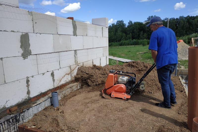 Use of a Vibrating Plate on Construction, Heavy Construction Tools and ...