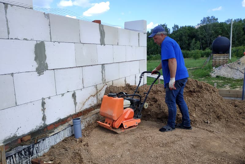 Use of a Vibrating Plate on Construction, Heavy Construction Tools and ...