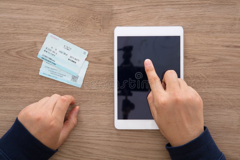 Use Your Hand To Operate the Tablet Computer and Grab the Train Ticket ...