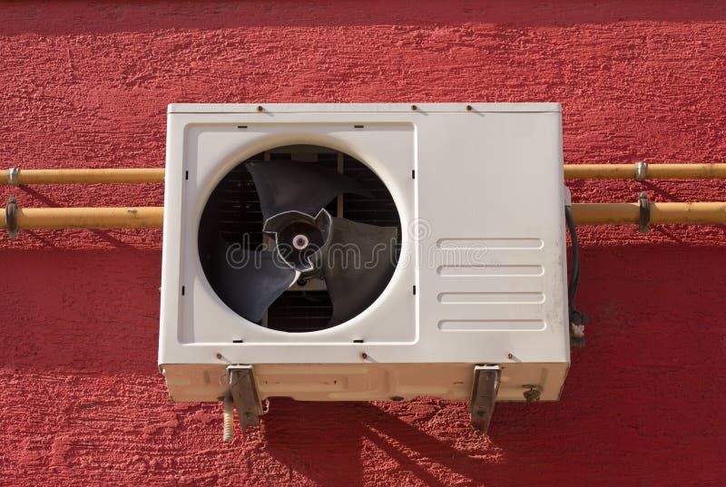 Used Air Conditioner on a Red Wall Stock Image - Image of power ...