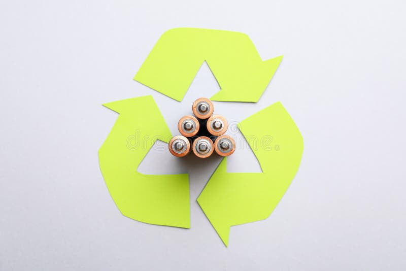Used Batteries and Recycling Symbol on White Background, Top View Stock ...