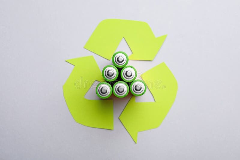 Used Batteries and Recycling Symbol on White Background, Top View Stock ...
