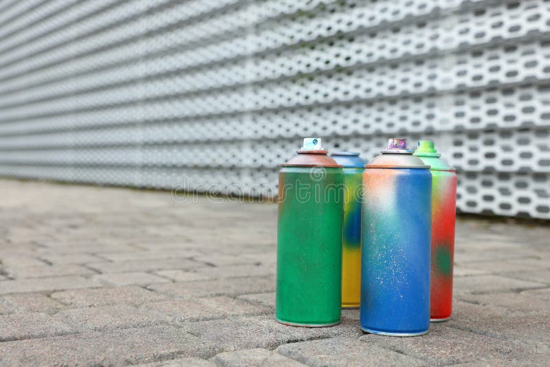 Used Cans of Spray Paints on Pavement, Space for Text Stock Photo ...