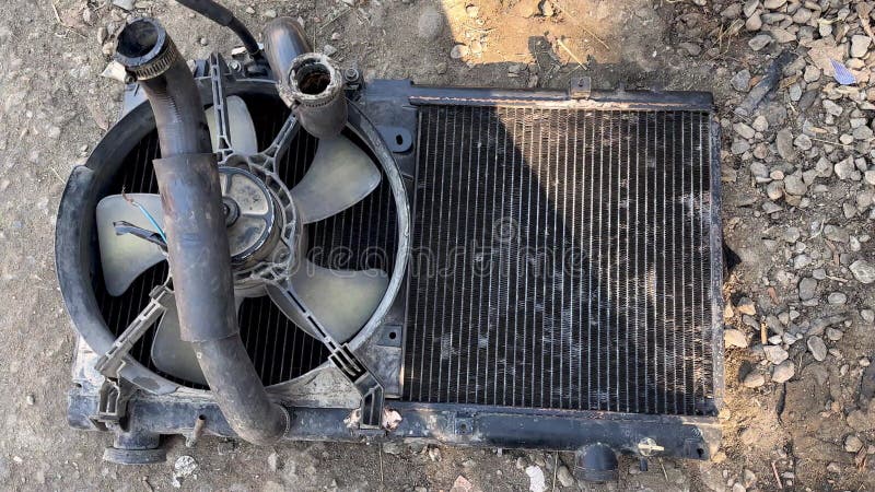 Used Car Radiator with Fan and Rubber Hose Stock Video - Video of ...