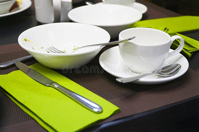 Used cutlery on the table stock photo. Image of dishware - 163745694