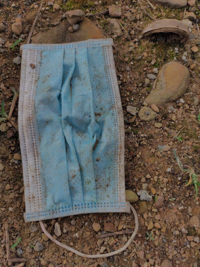 Used Discarded Mask on the Ground Stock Image - Image of headstone ...