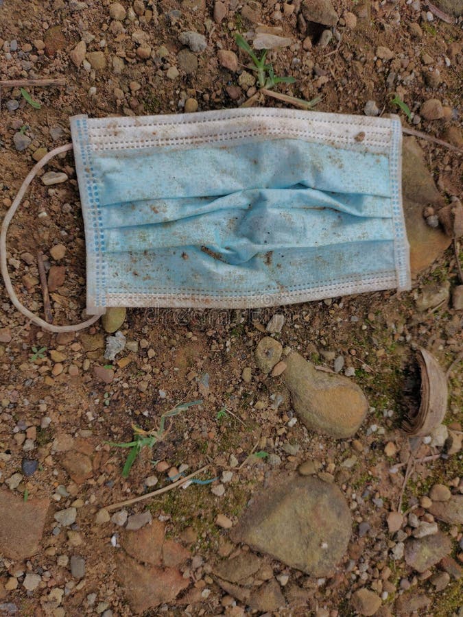 Used Discarded Mask on the Ground Stock Photo - Image of wall, spring ...