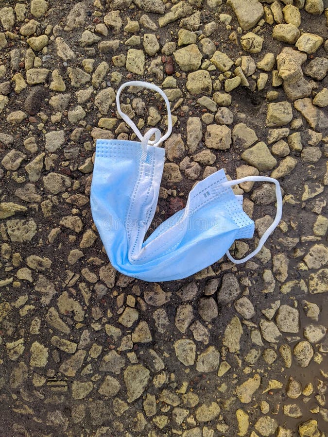 Used Disposable Mask is Lying on the Street Stock Photo - Image of ...