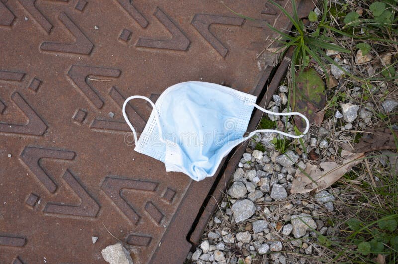 Used Face Mask Drop on Ground Grass Floor, Save the Nature. Garbage ...