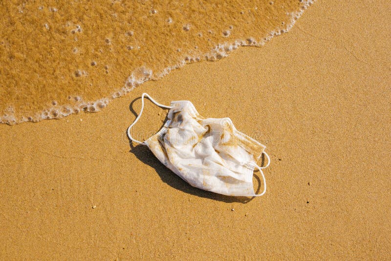 Used Face Mask on the Sand. Covid-19 Protection Stock Image - Image of ...