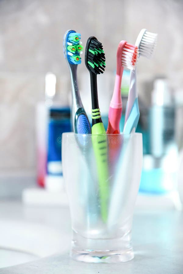 Used Family Toothbrushes on the Bathroom Counter Stock Image - Image of ...