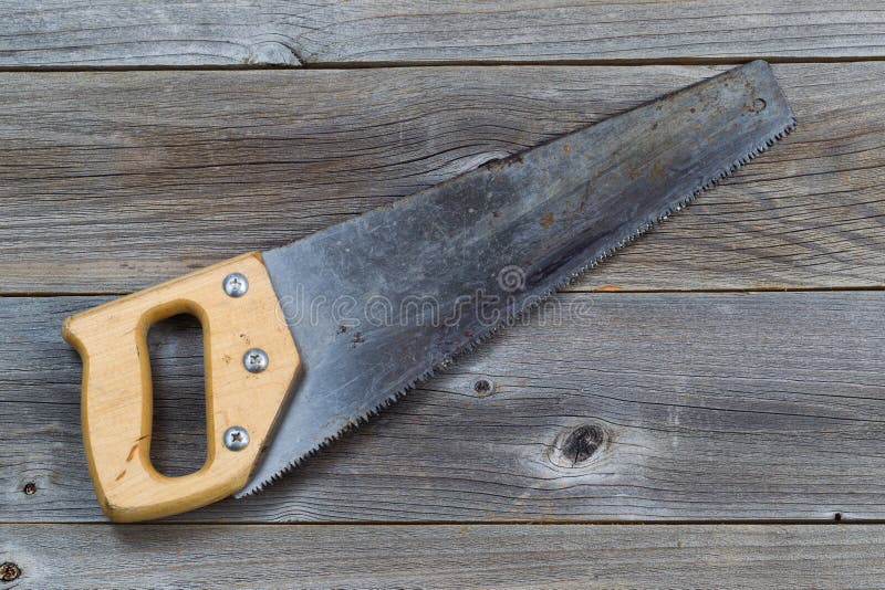 Used Hand Saw on Rustic Wood Stock Image - Image of space, hardware ...