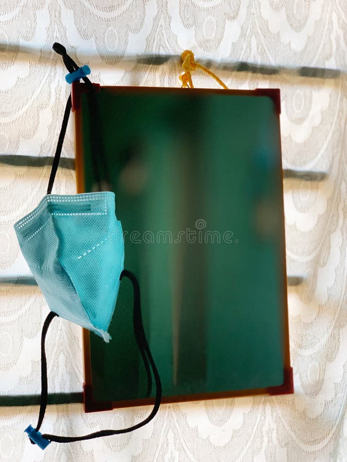 Used Mask Left Over a Mirror in Doctors Room during Covid Days Stock ...
