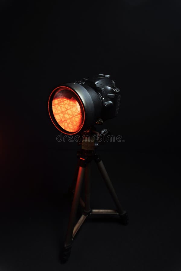 Black SLR Camera on a Tripod in a Studio in Red Light Stock Image ...