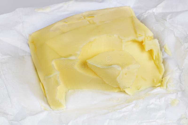 Used Old Piece of Cow Butter on Foil Packaging Stock Photo - Image of ...
