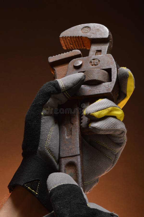 Pipe Wrenches in Hand of Workman Stock Photo - Image of craftsmanship ...