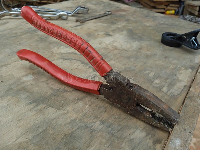 The Used Pliers are Placed on the Board Stock Photo - Image of dirty ...