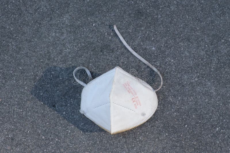 Used Protective Mask on an Asphalt Ground Stock Image - Image of ...