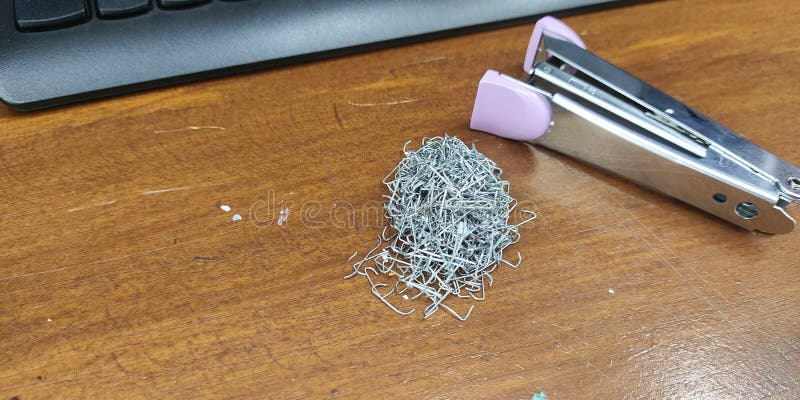 Used Staplers and Staples Piled Up on the Work Table Stock Photo ...
