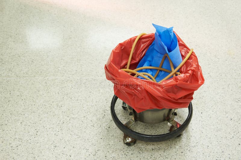 A Used Suction Tube in Red Garbage Bin Stock Photo - Image of ...