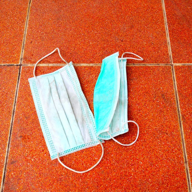 Used Surgical Mask on the Floor. Discarded Mask. the Mask that Was ...