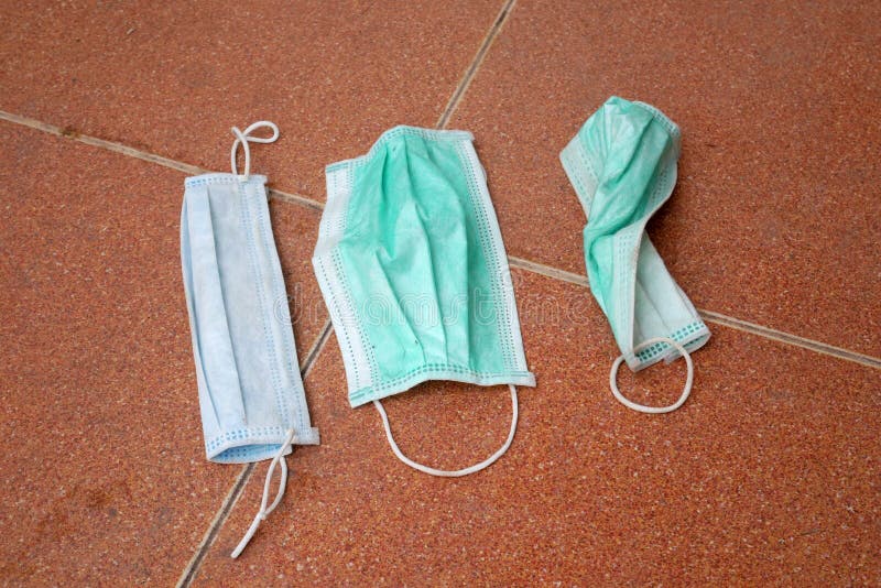 Used Surgical Mask on the Floor. Discarded Mask. the Mask that Was ...