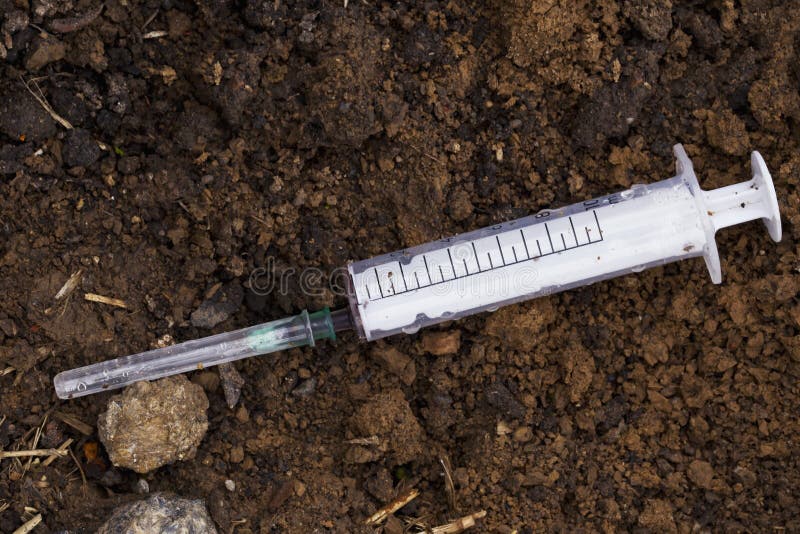 The used syringe stock photo. Image of crime, soil, used - 69425258