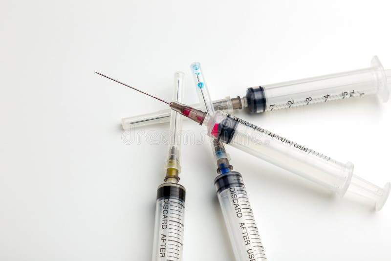 Used Syringes with a Protective Cap on the Needle with Colored ...