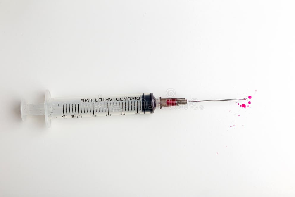 Used Syringes with a Protective Cap on the Needle with Colored ...
