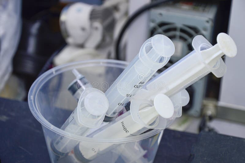 Used Syringes Put in a Clear White Container Stock Photo - Image of ...