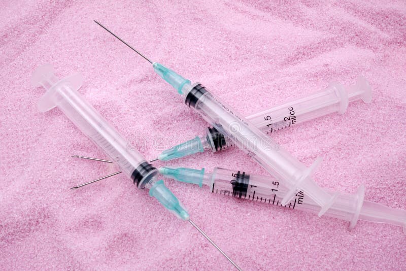 Used syringes on sand stock image. Image of pink, used - 89702411