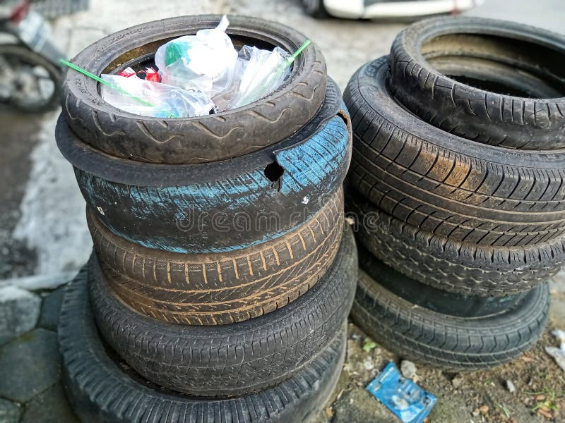 Used tires for trash bin stock photo. Image of dirty - 215186024