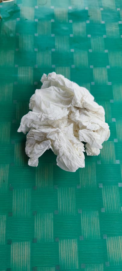 The USED TISSUE WAS USED and WAS on a GREEN TABLE Stock Photo - Image ...