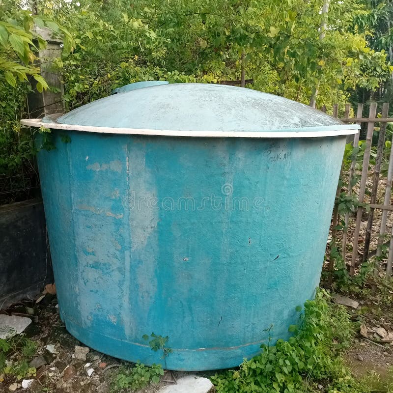 Used Water Tank in the Yard Stock Image - Image of green, tank: 240456285