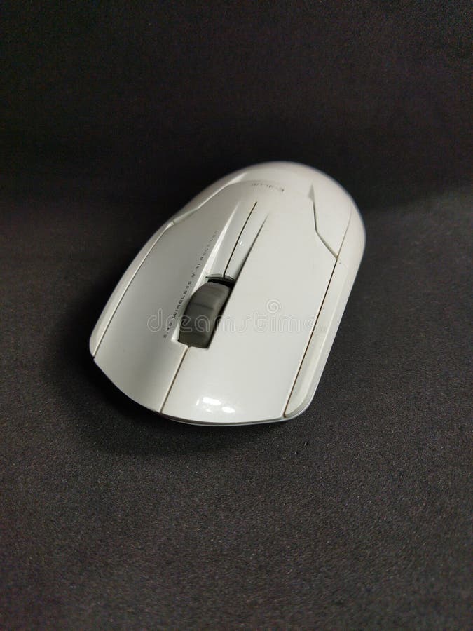 A Used White Wireless or Bluetooth Mouse on a Black and White ...