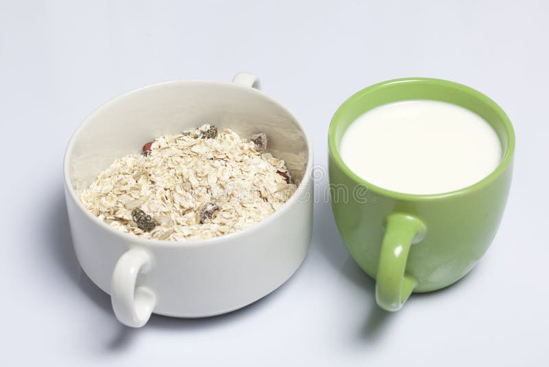 Useful Breakfast. Muesli in a Cup and a Mug of Milk. on a White ...