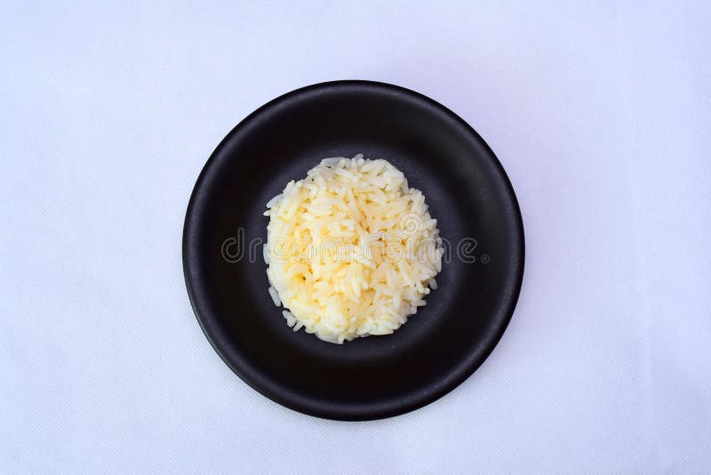 White Rice in a Black Plate Stock Image - Image of yellow, bowl: 103230947