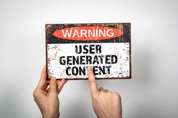 USER GENERATED CONTENT. Warning Sign on a White Background Stock Photo ...