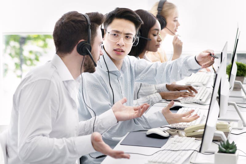 User Support Service Concept. Hotline Operator Helping His Coworker at ...