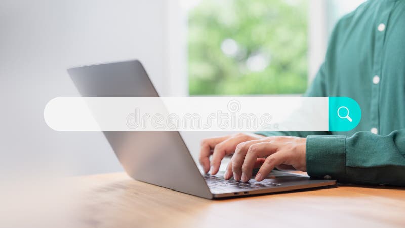 User Working with a Laptop Computer on Table in Office. Searching ...