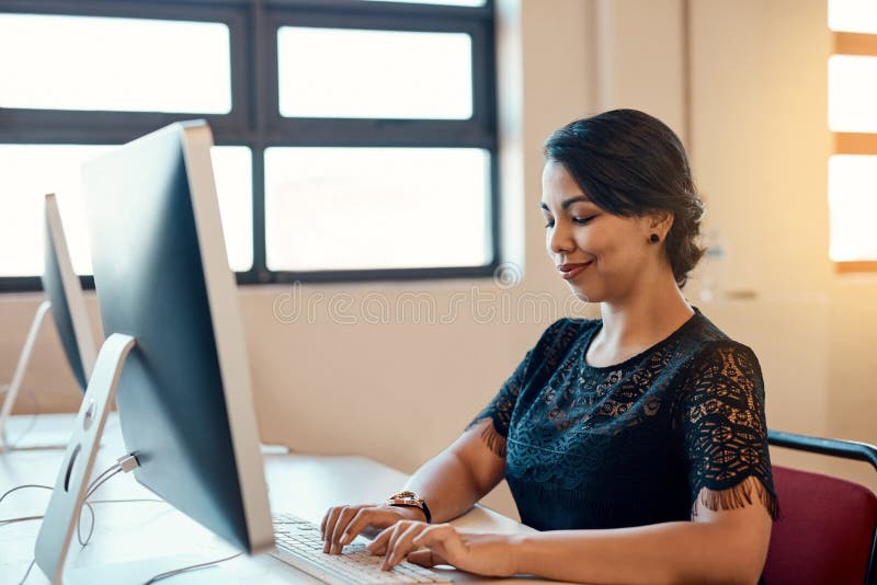 She Uses Her 8 Hours Wisely. a Young Businesswoman Using a Computer in ...