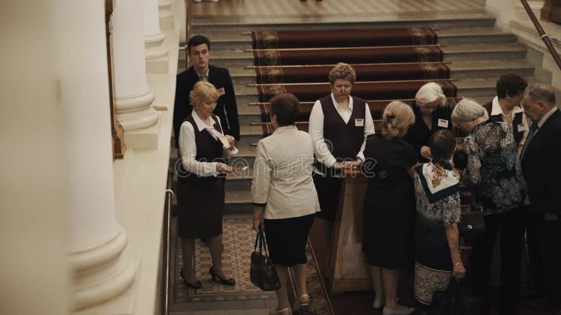 Usher Checking Tickets on Staircase in Old Style Concert Hall Corridor ...