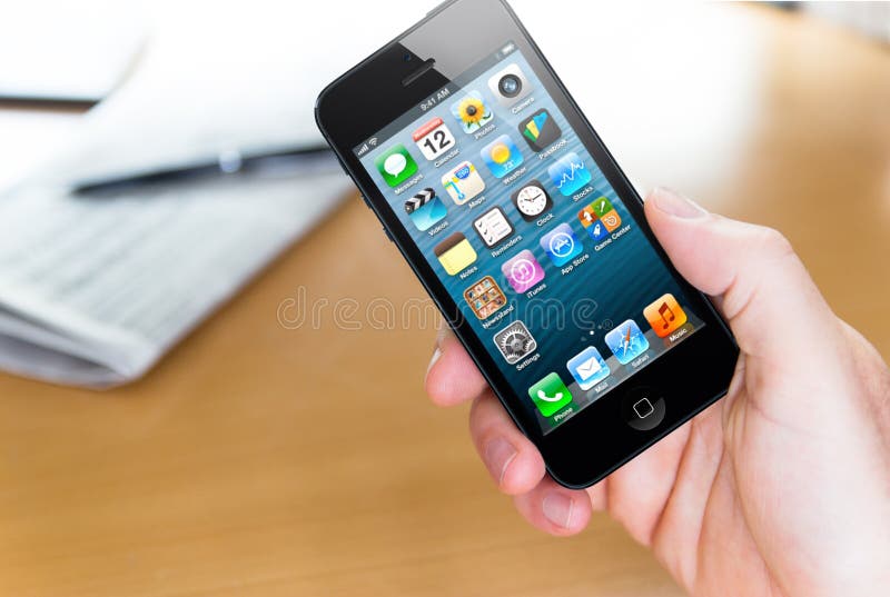 Using Apple iphone 5 editorial photography. Image of hand - 26702272