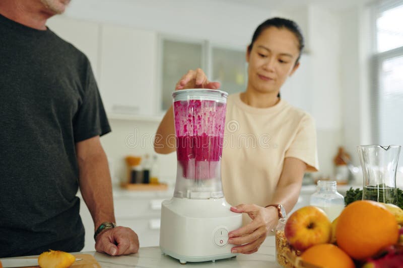 Using Blender in Bright Kitchen for Making Smoothie Stock Image - Image ...