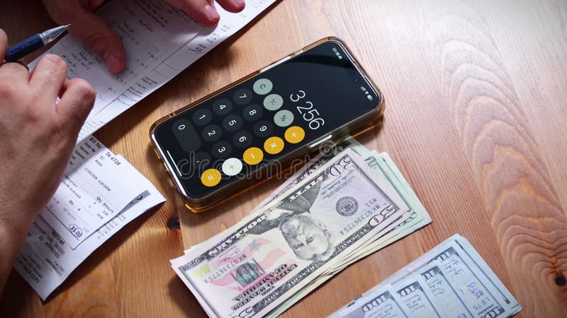 Using a Calculator To Add Up Bills with Precise Finger Gestures Stock ...