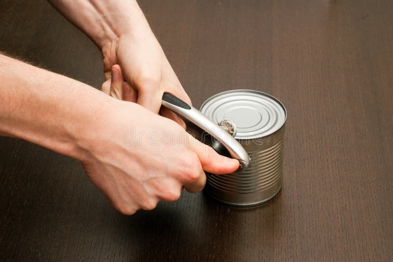 Using can-opener stock photo. Image of kitchen, human - 13305024