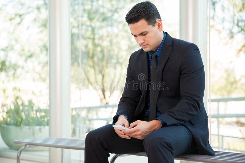 Using a cell phone at work stock image. Image of businessman - 47881549