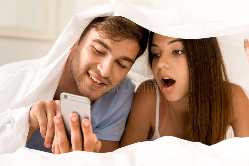 Using a Cellphone Under the Sheets Stock Photo - Image of internet ...